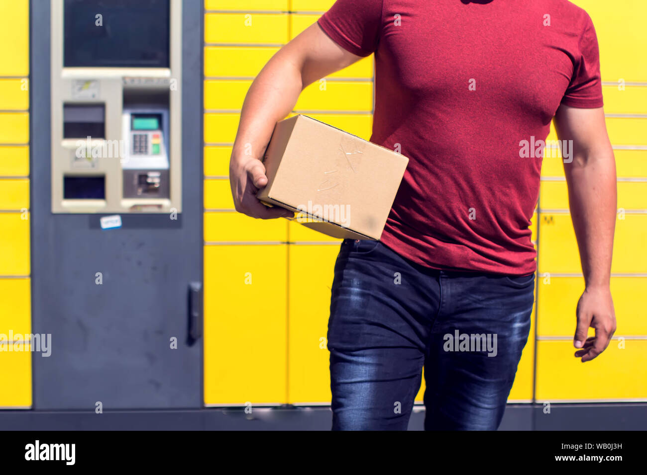 Man received a parcel using automated self-service post terminal ...