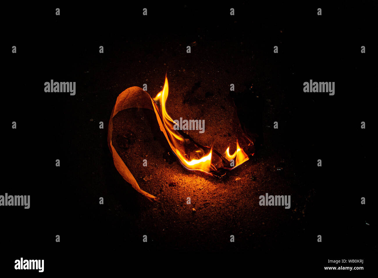 Fire on the ground in a dark place, France Stock Photo - Alamy