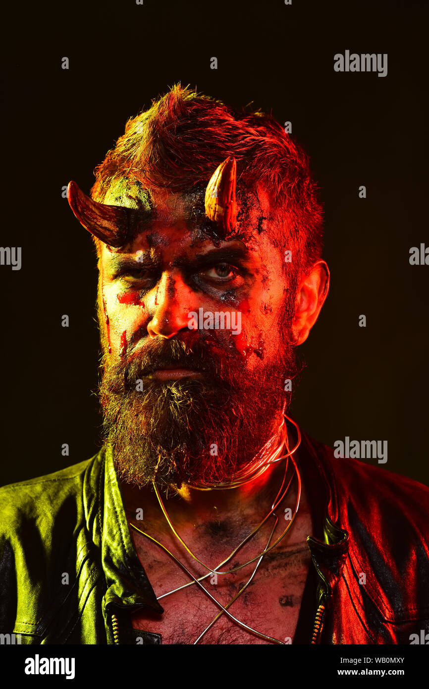 Halloween devil with bloody horns on head. Satan with beard, red blood ...