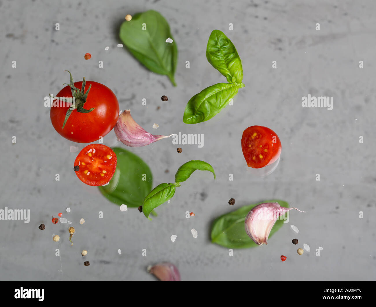 flying vegetables and herbs for salad Stock Photo - Alamy