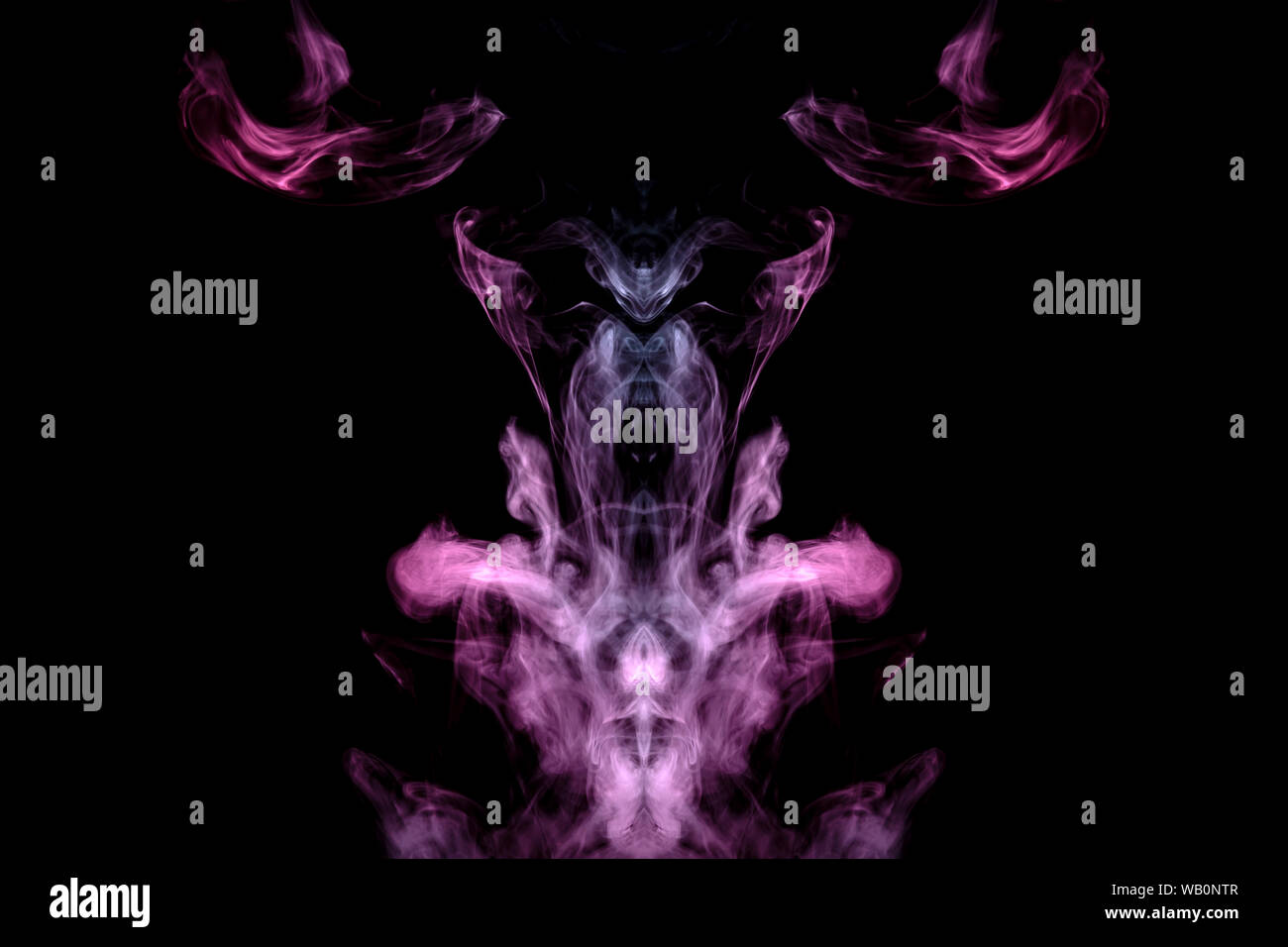 Smoke of different blue, red and pink colors in form of horror in the ...