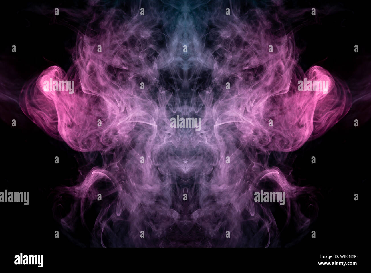 Smoke of different blue, red and pink colors in form of horror in the ...