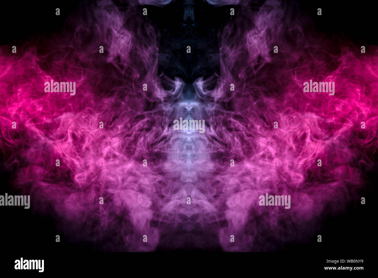 Smoke of different blue, red and pink colors in form of horror in the ...