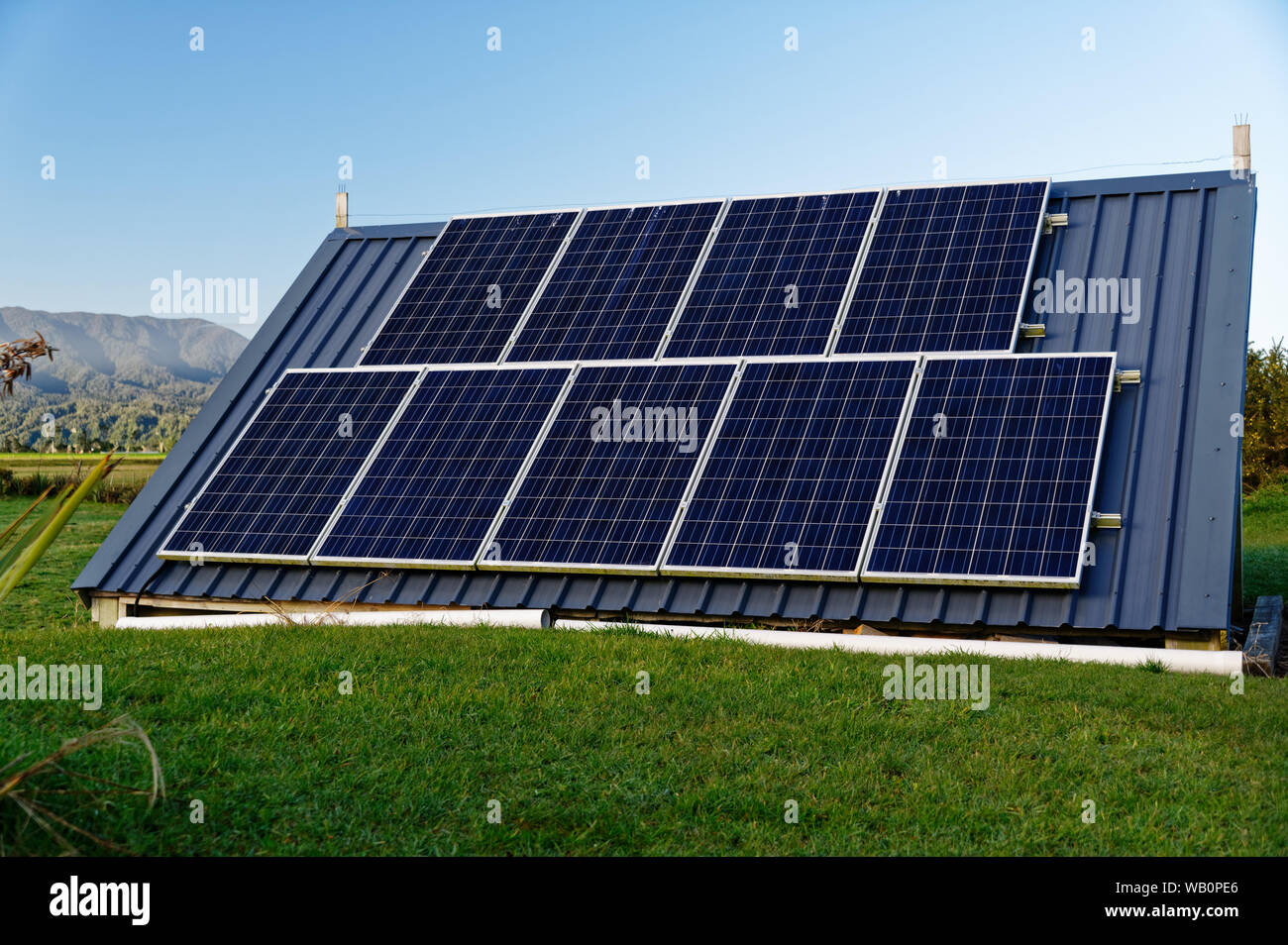 Solar panels power an off grid electricity system Stock Photo - Alamy