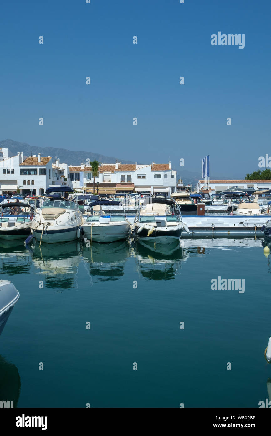 Puerto Banus, Marbella, Spain. Waterfront shops and apartments surround ...
