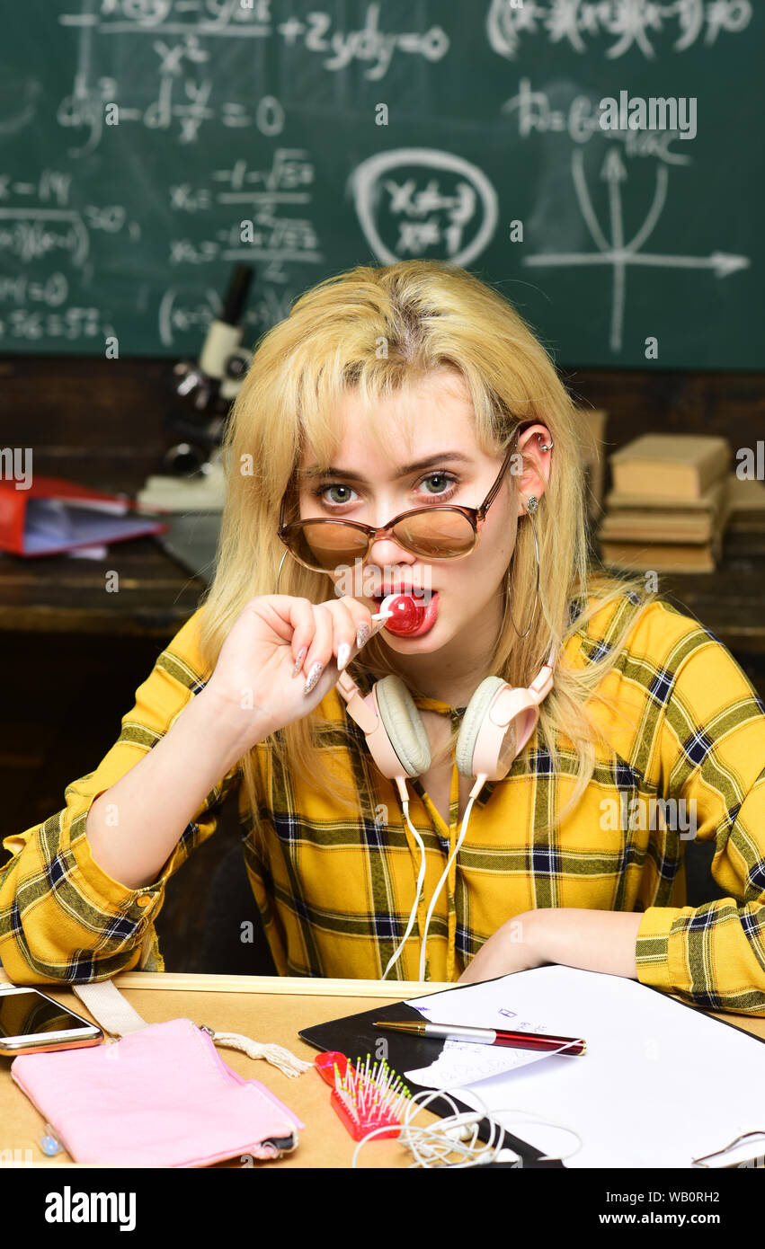 Happy university students studying with books in library. Students ...