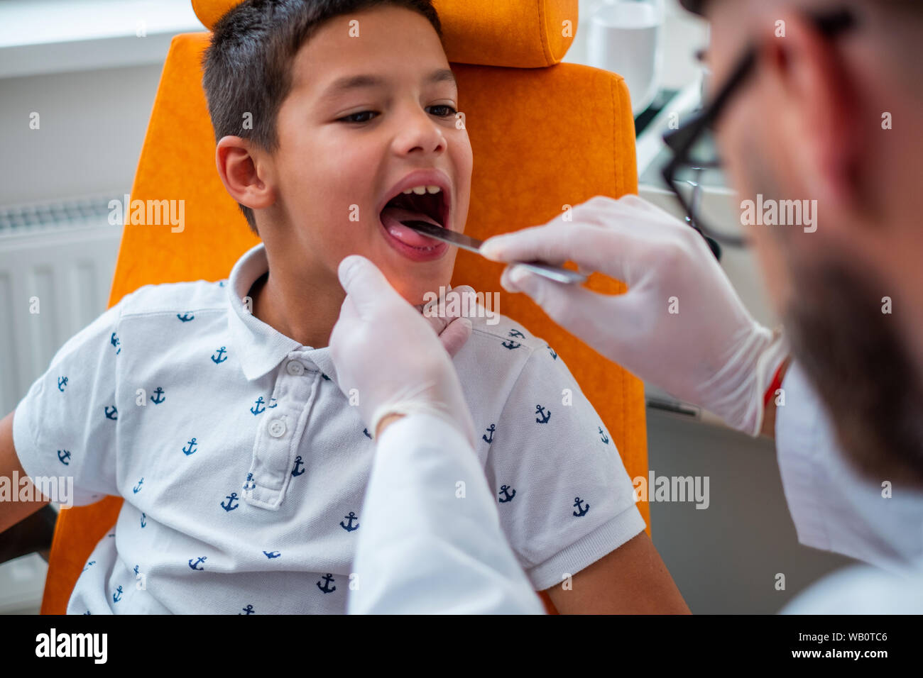 Boy at check-up at aryngologist Stock Photo - Alamy