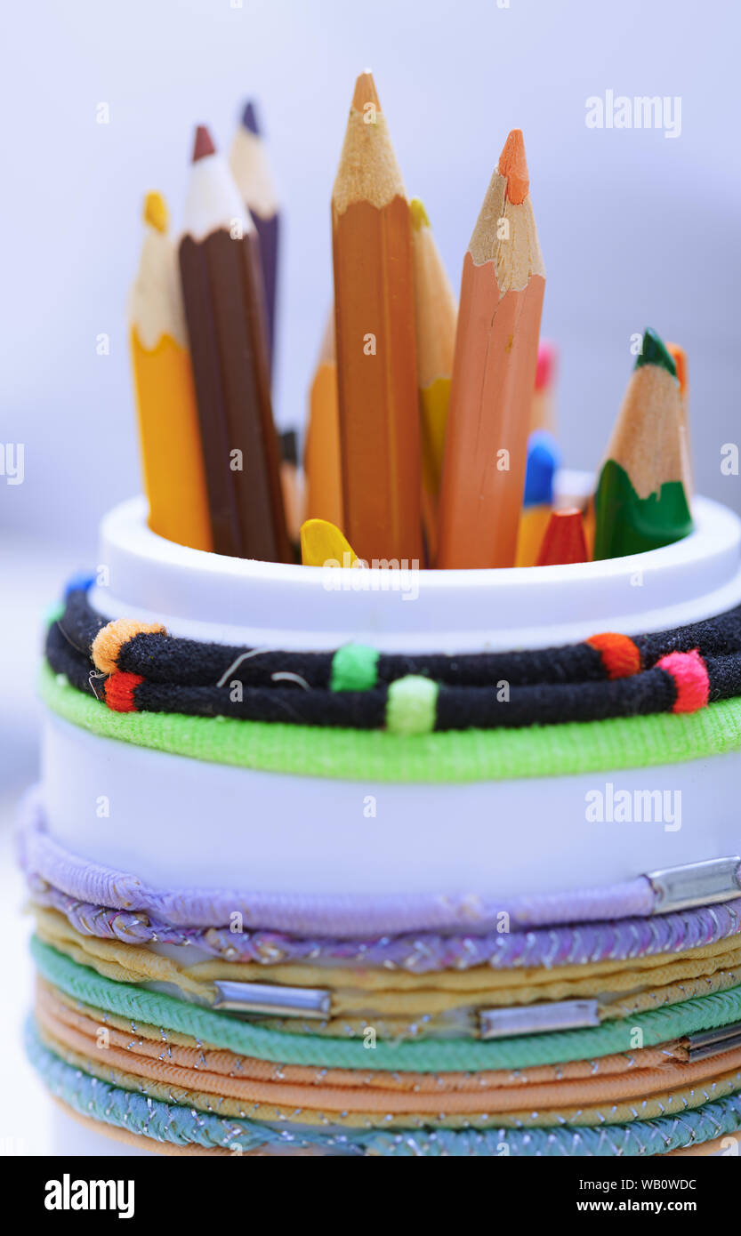 Color pencils in the plastic jar. Close-up Stock Photo - Alamy