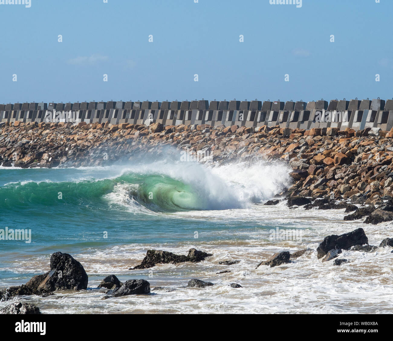 Blue green glassy looking Waves breaking, rolling over and crashing as ...