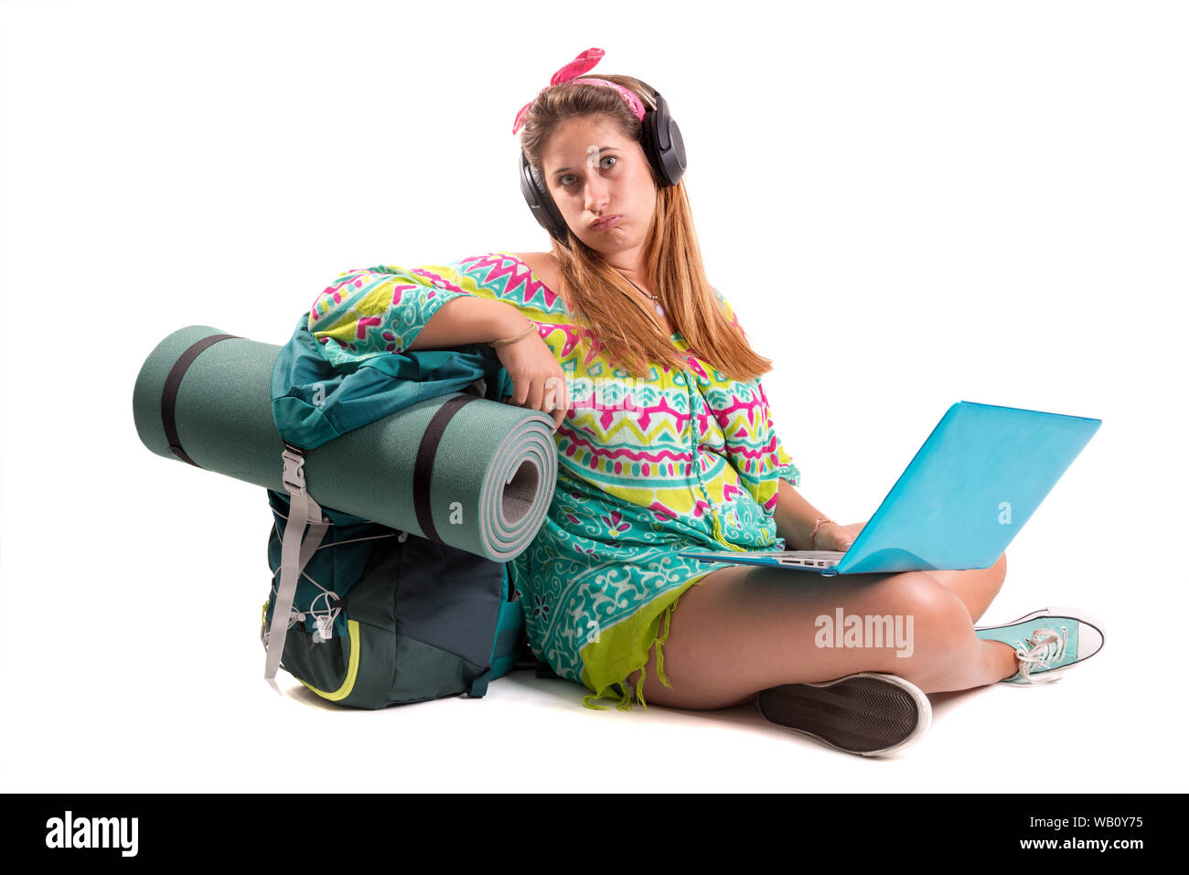 Lost and stressed girl with many devices looking for directions ...