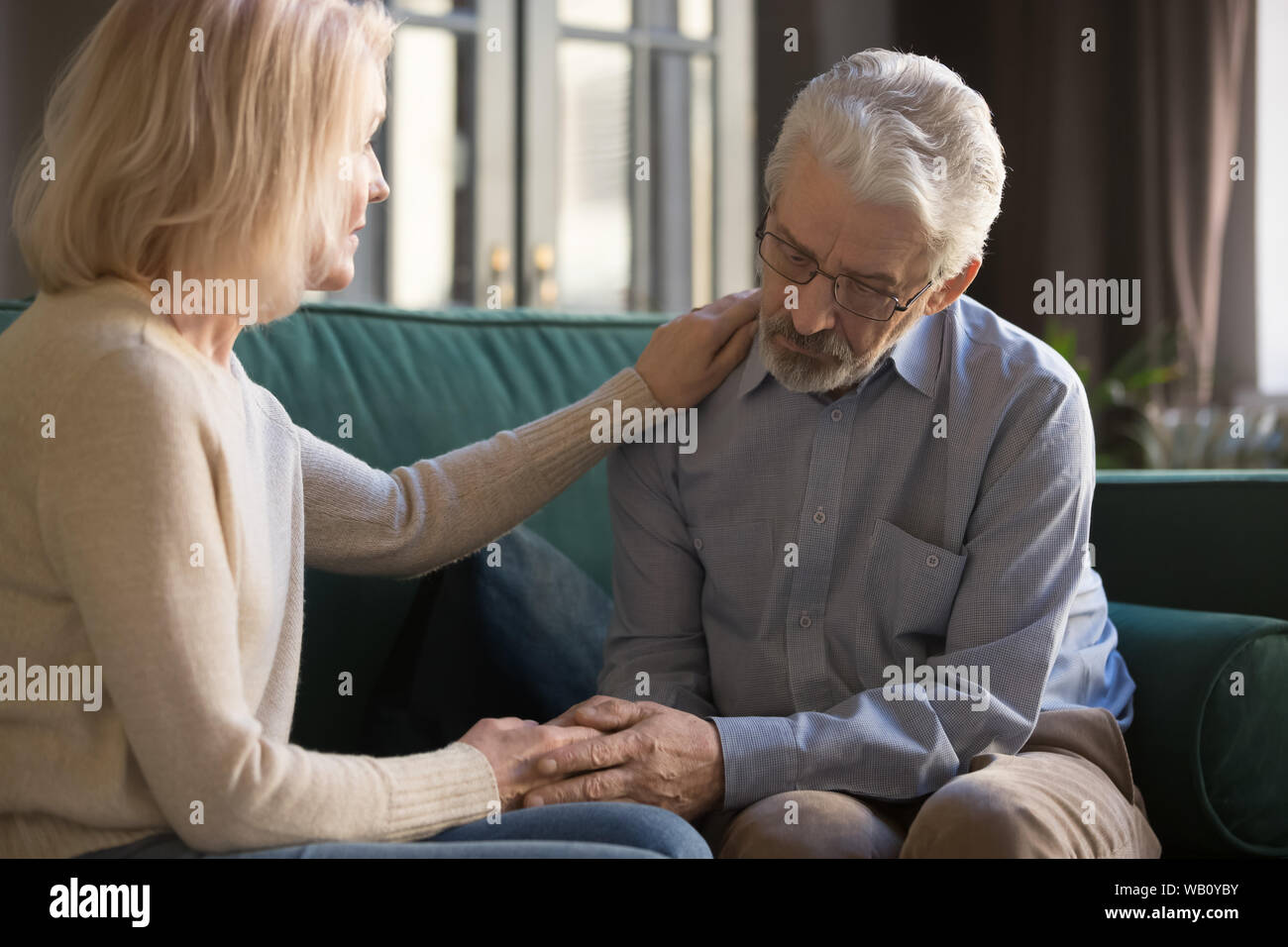 Husband consoling sad wife hi-res stock photography and images - Alamy