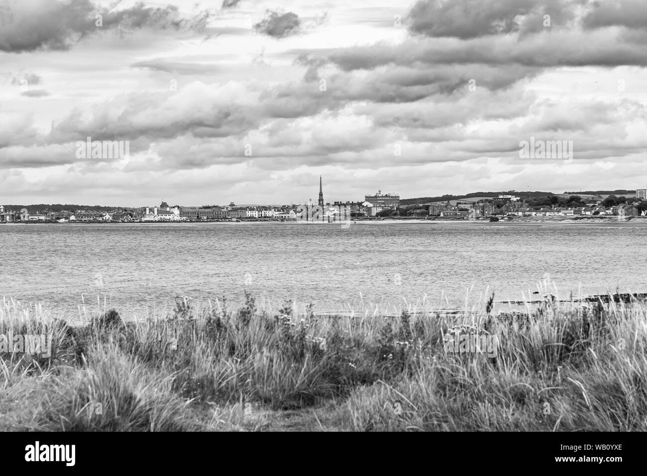 Greenan Shoreline looking across the bay towards the town of Ayr in the ...