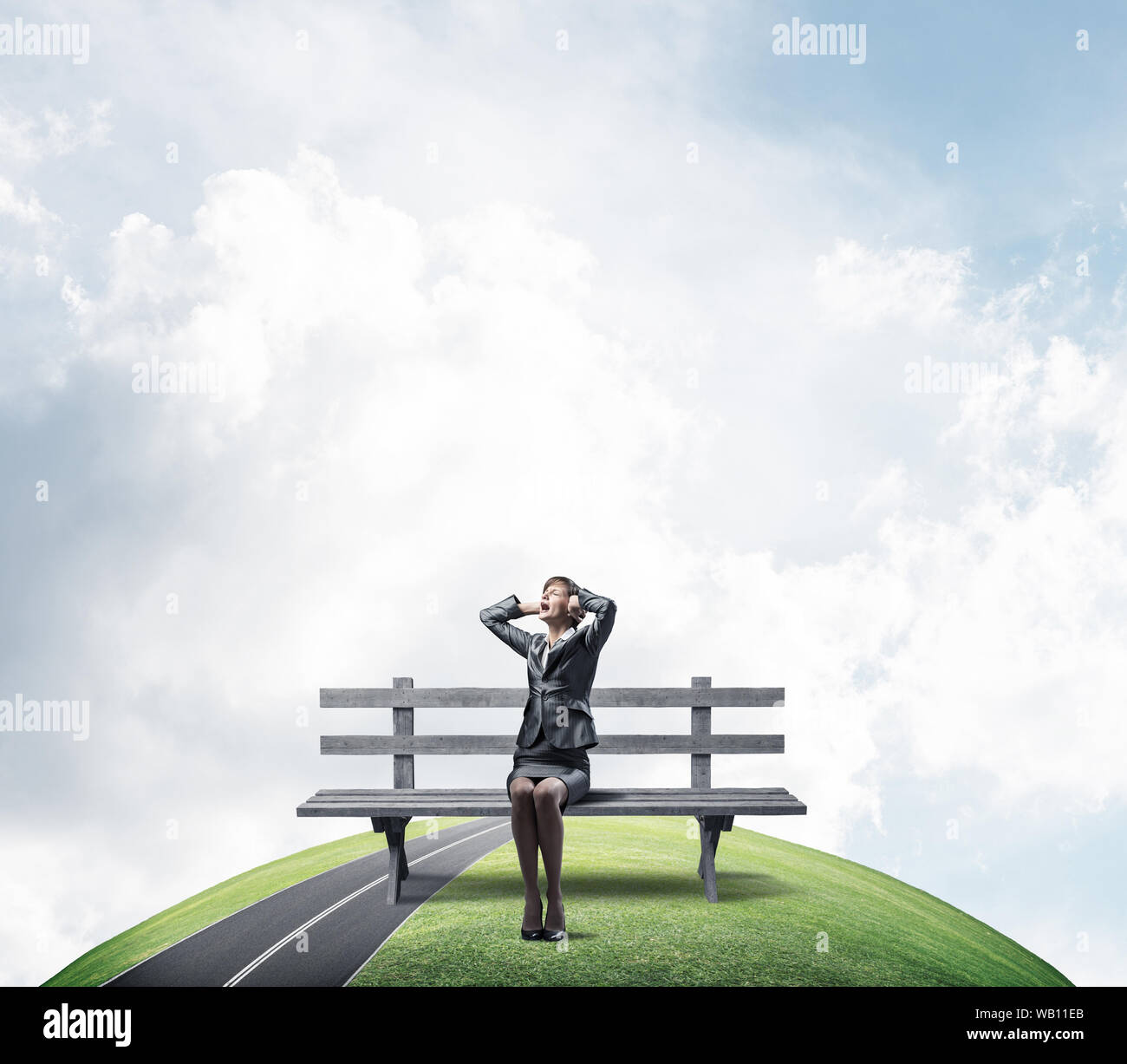 Stressful woman sitting on wooden bench. Emotional screaming girl keeps ...