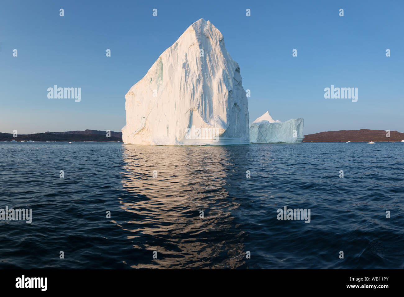 Iceberg at sunset. Nature and landscapes of Greenland. Disko bay. West ...