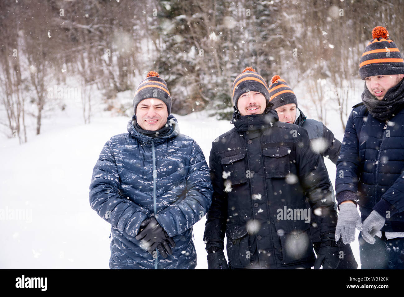 group portrait of young happy business people enjoying snowy winter day ...