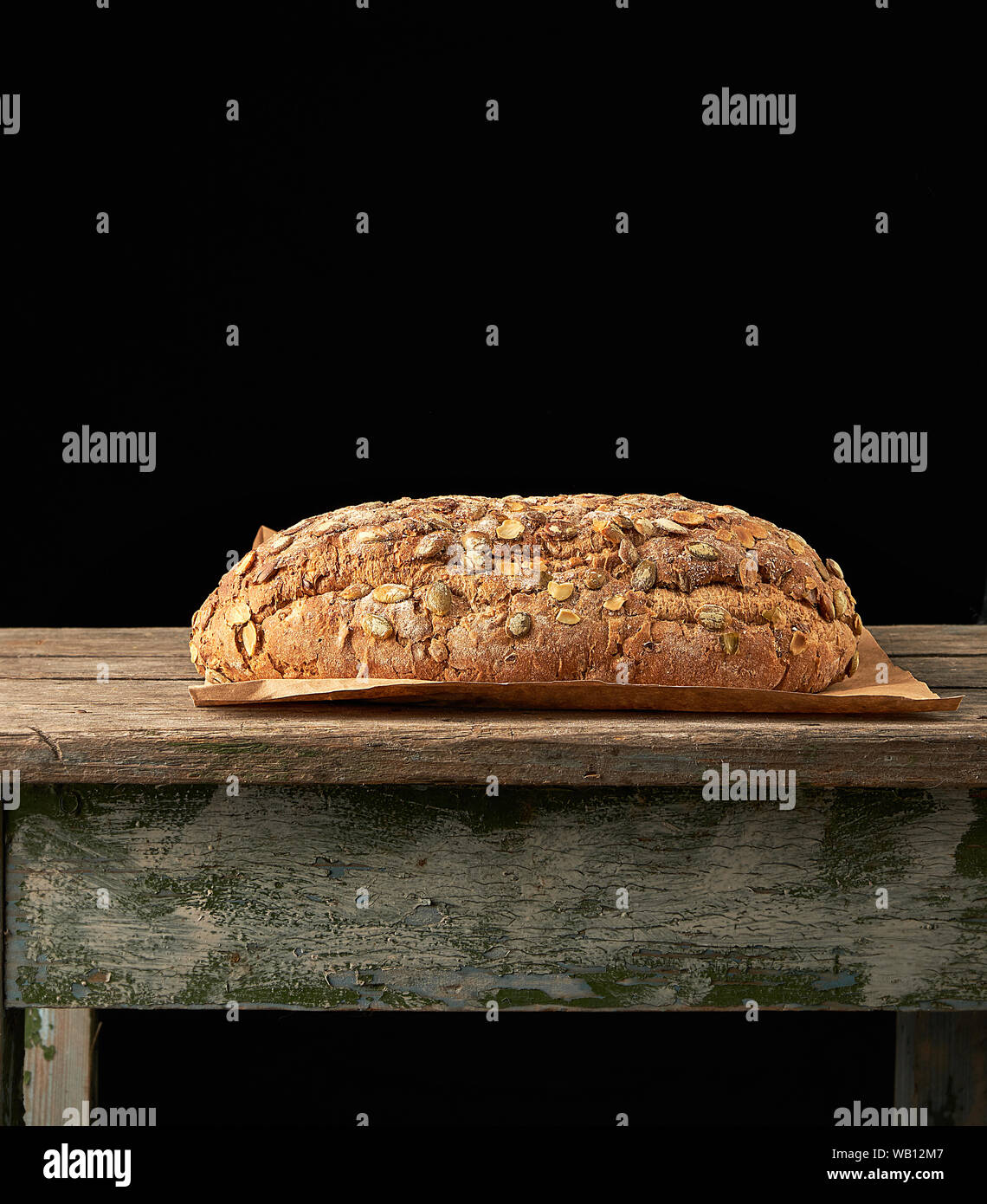 baked oval bread made from rye flour with pumpkin seeds , black ...