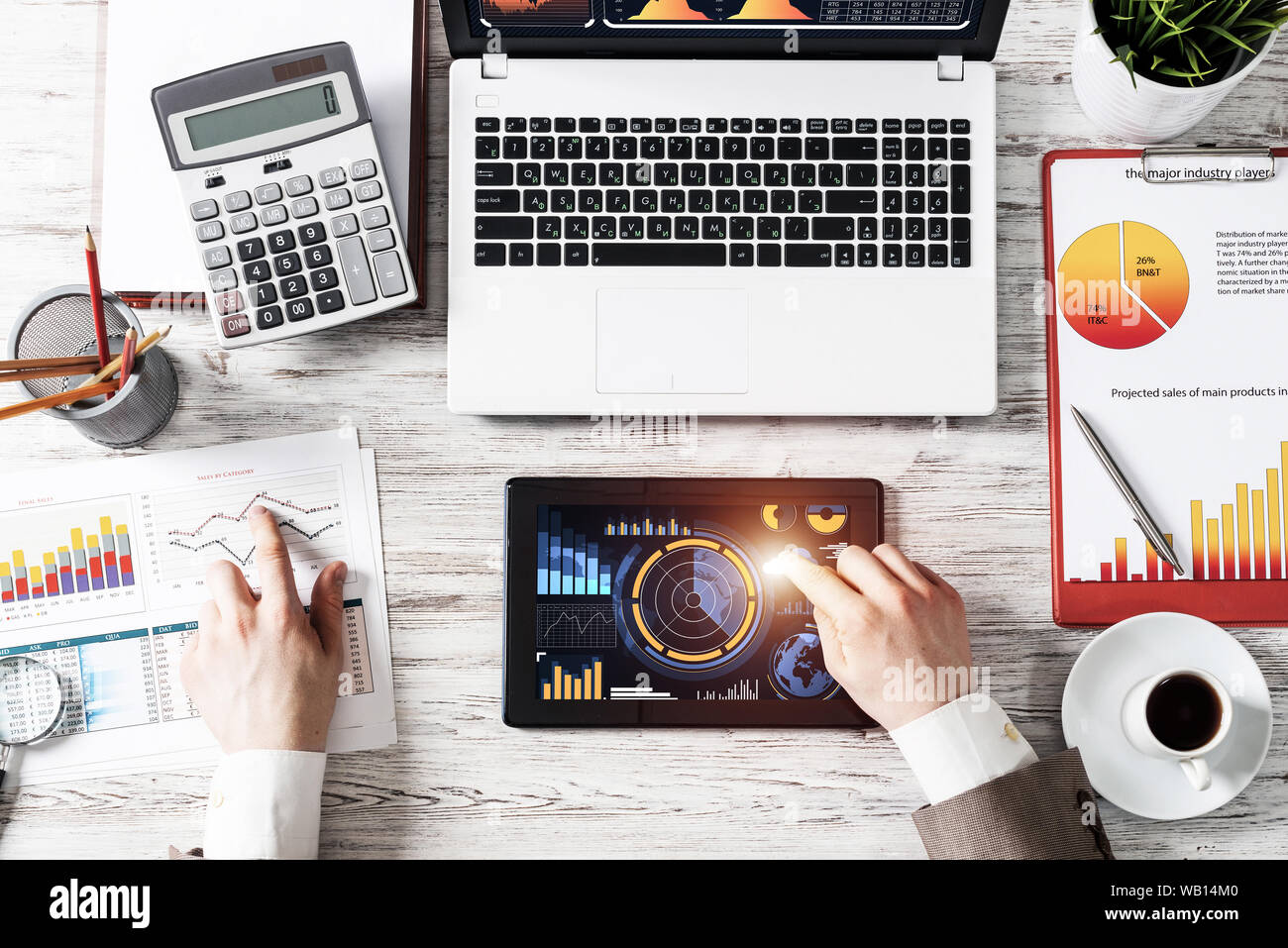 Businessman working at office desk with financial data. Professional ...