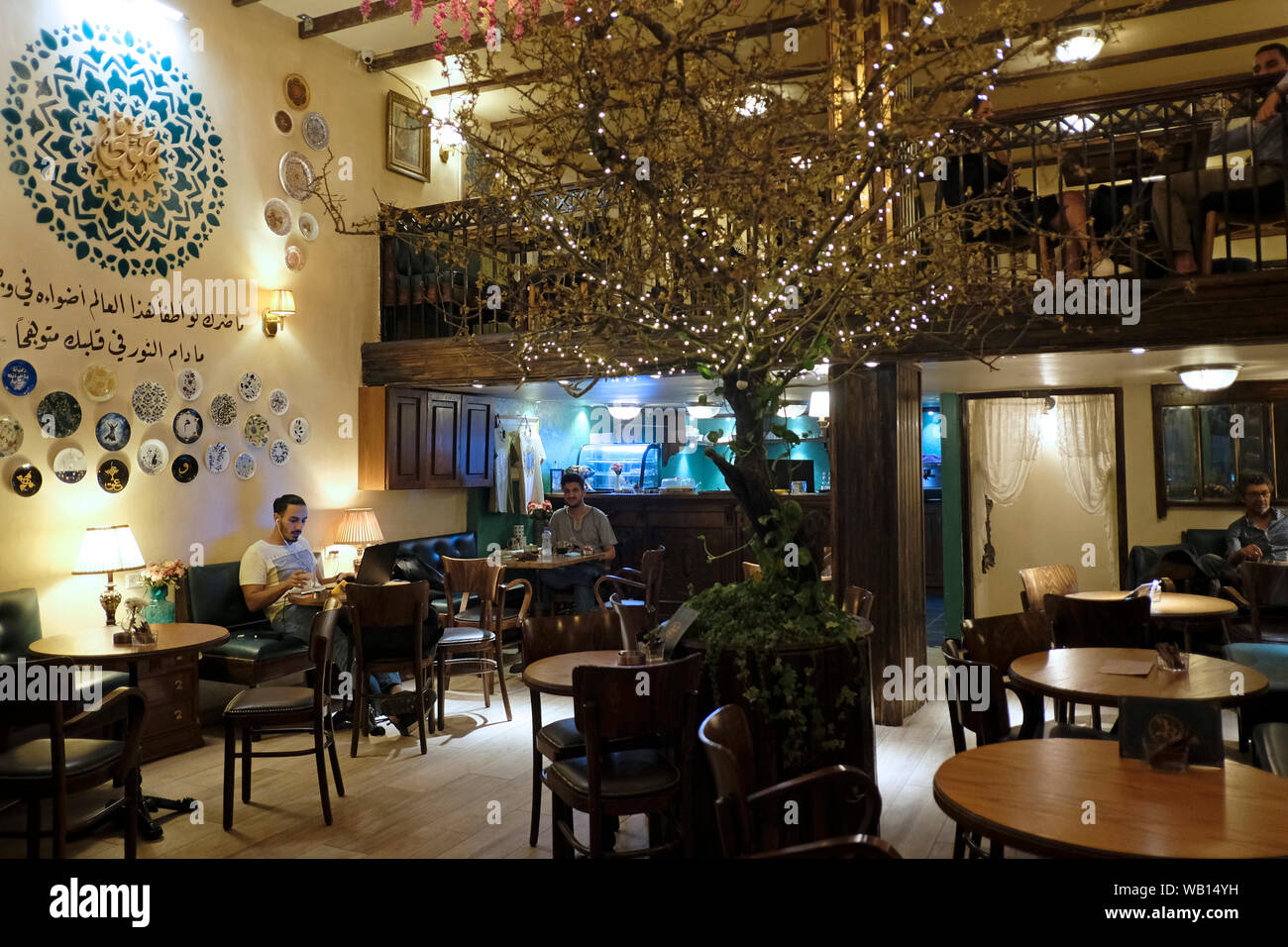 Young Palestinians sitting in a trendy coffee house in the old city of ...