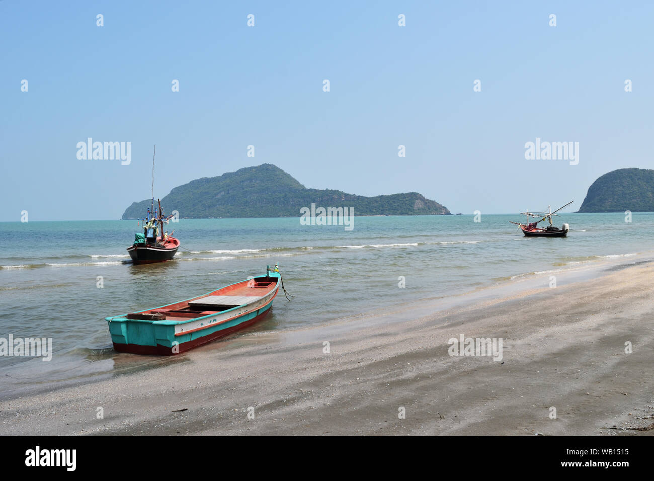 Fishing boats float in the sea with island in background , Khao Sam Roi ...