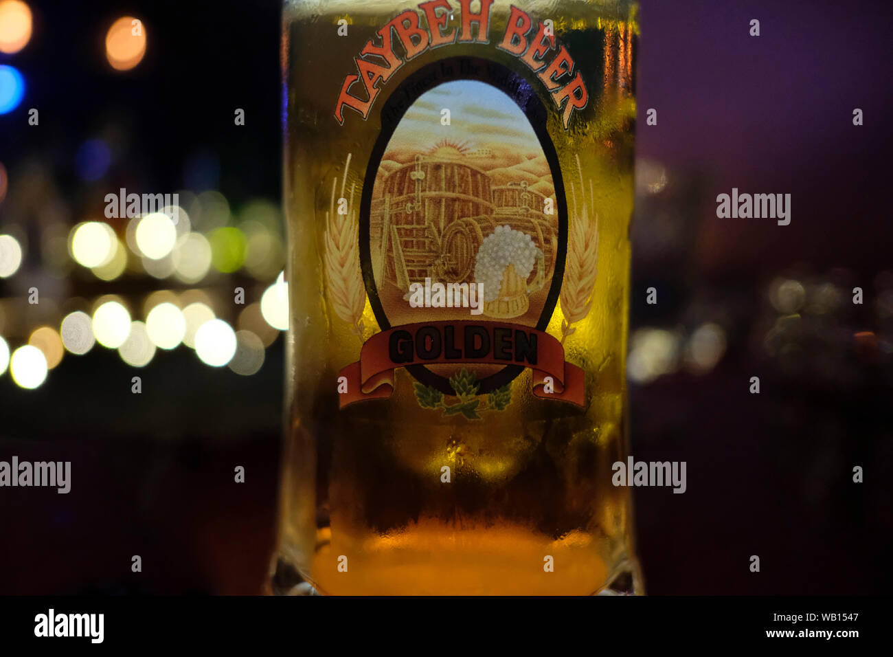 A glass filled with the local Palestinian Taybeh beer in a bar in ...