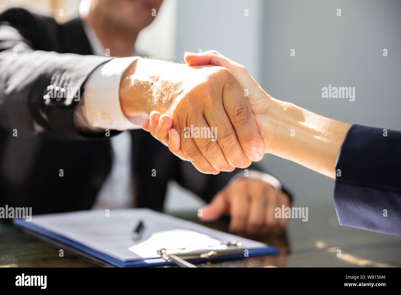 Hand shaking customer hi-res stock photography and images - Alamy