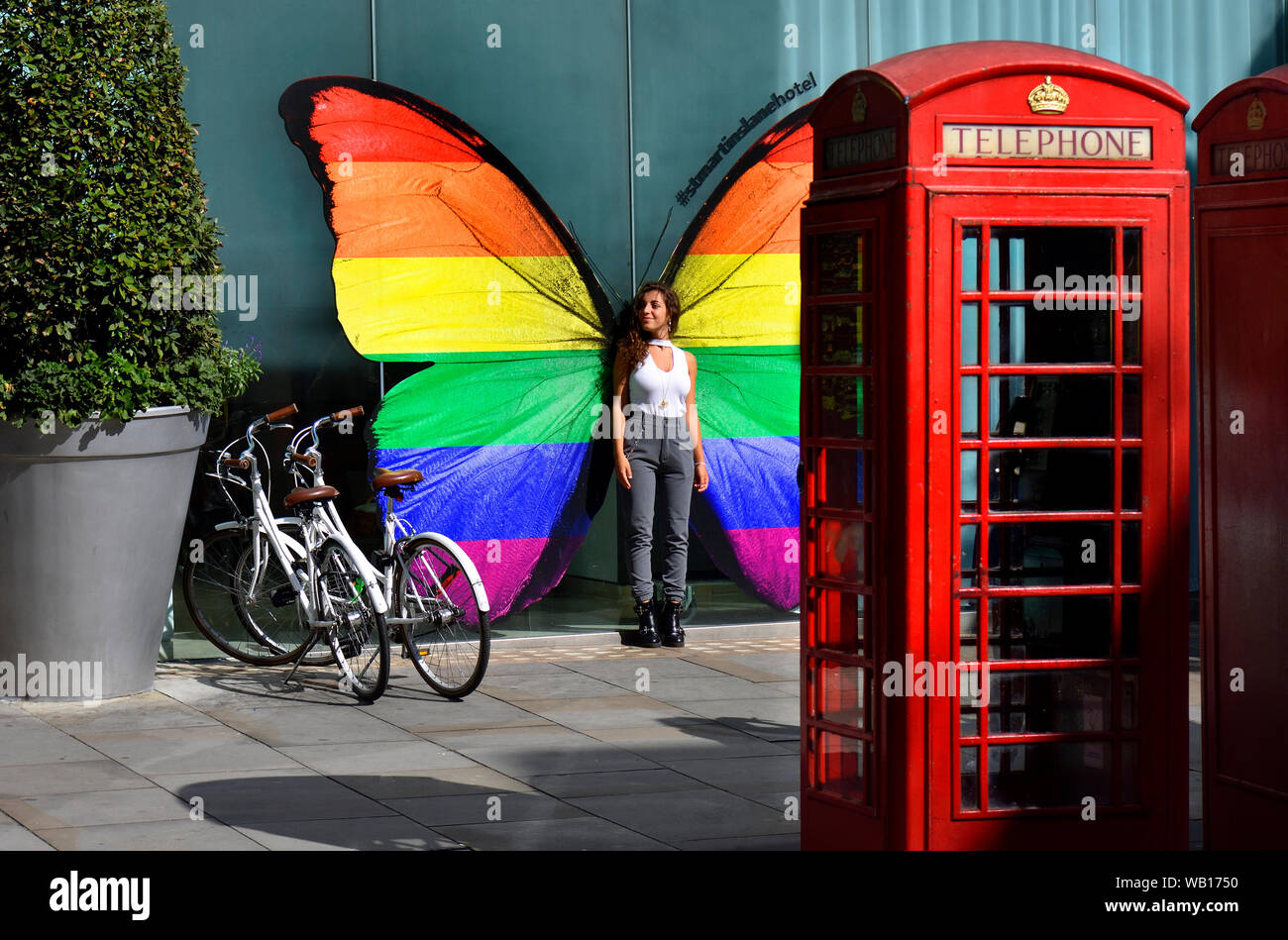 London, England, UK. Colourful butterfly on the wall of the St Martin's ...