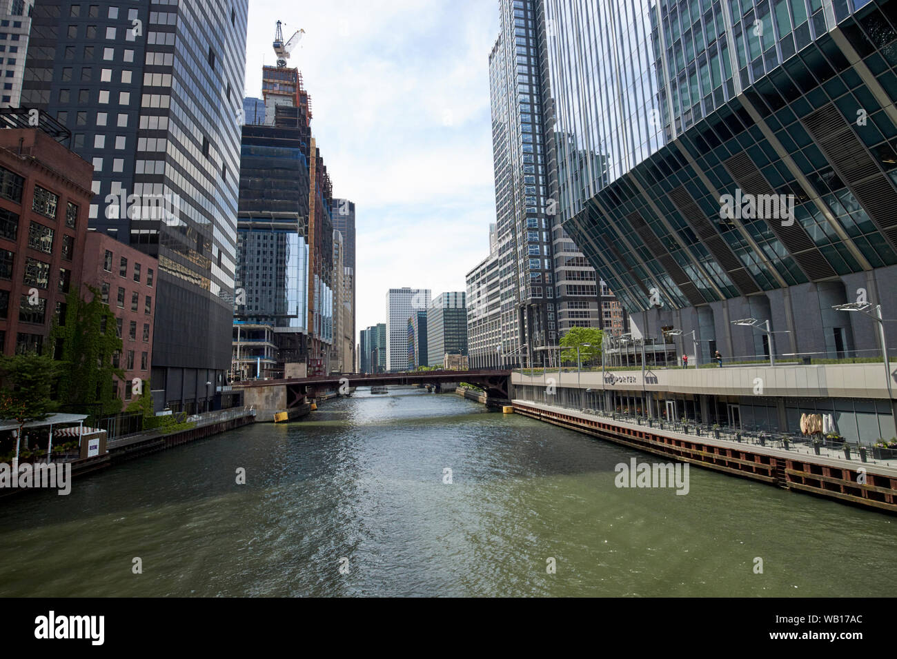 canyon of skyscrapers and buildings surrounding the chicago river as ...