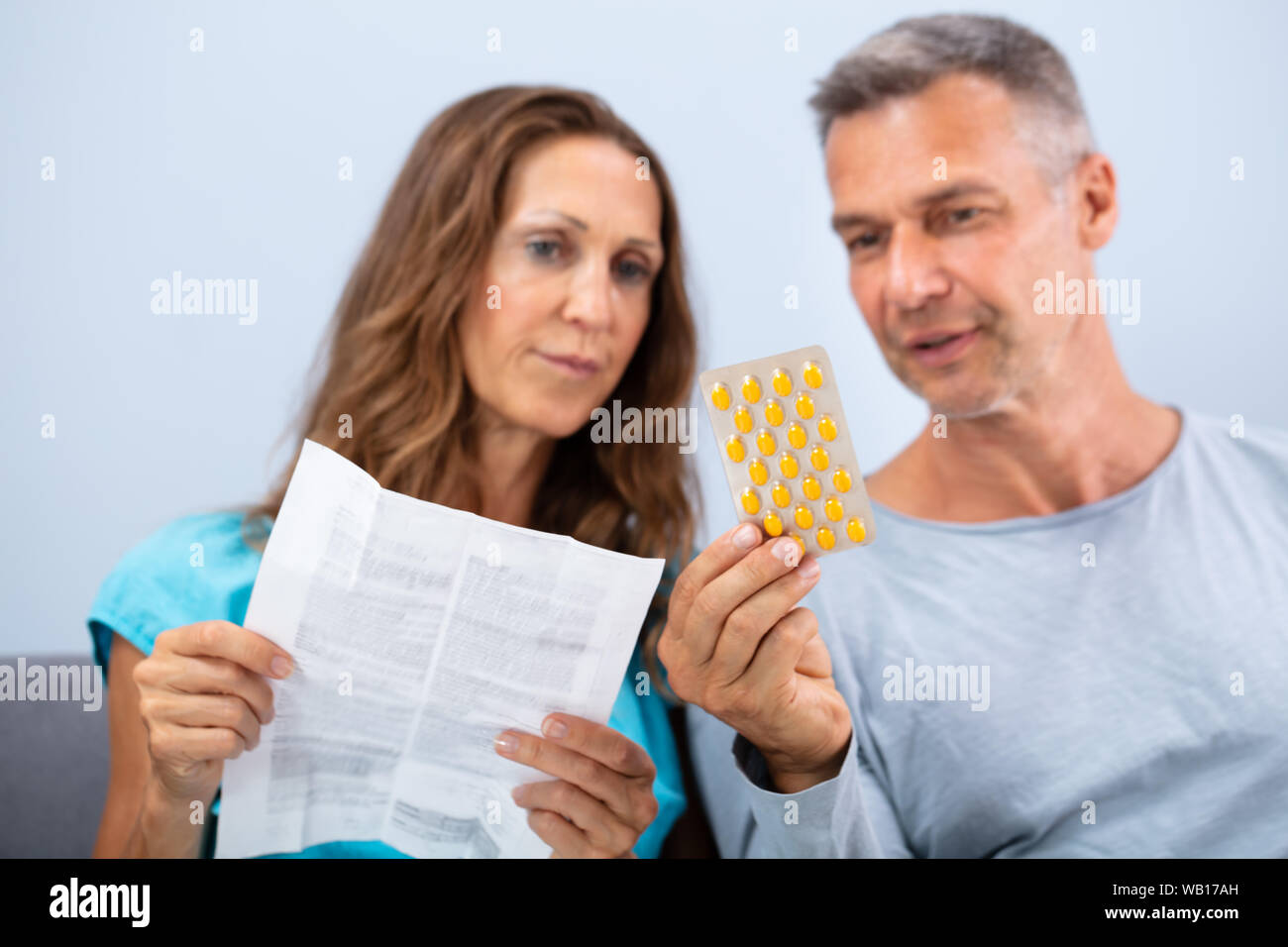 Older man reading leaflet hi-res stock photography and images - Alamy
