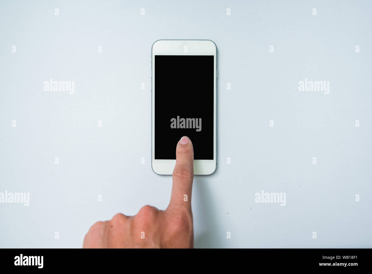 hand using mobile phone isolated white Stock Photo - Alamy