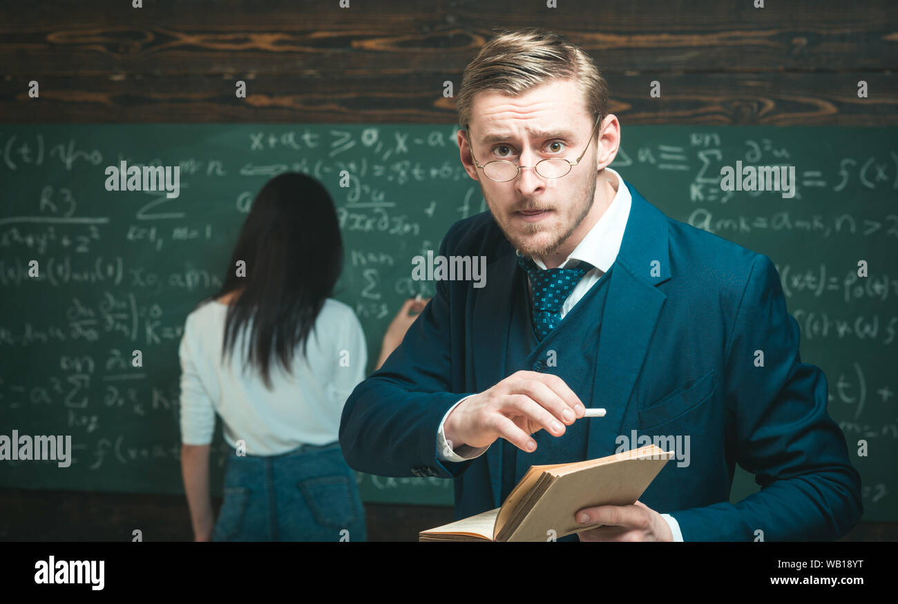 Teacher man using glasses scared in shock, expressing panic and fear at ...