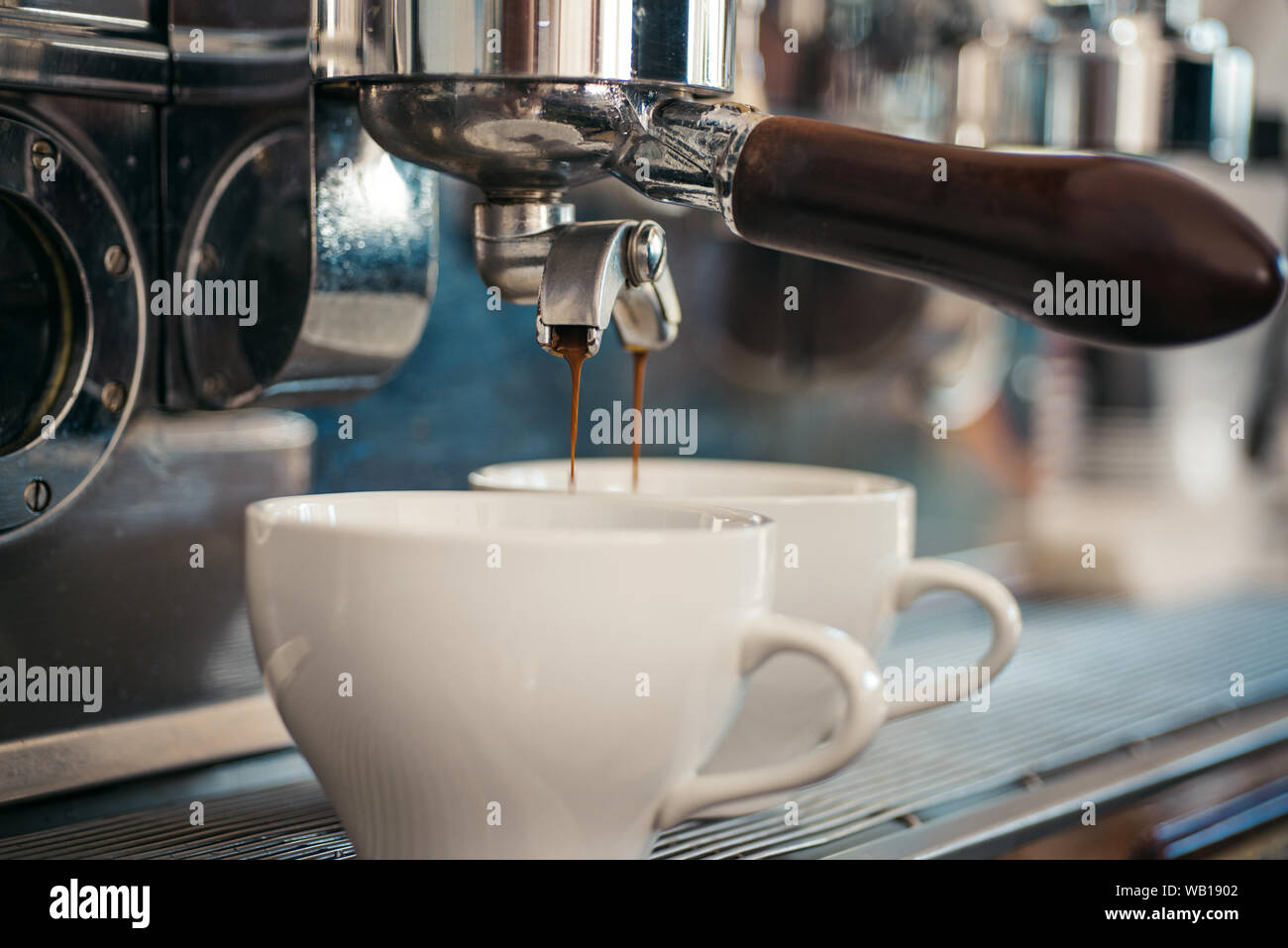 Enjoy barista style coffee. Coffee being brewed in coffeehouse or cafe ...