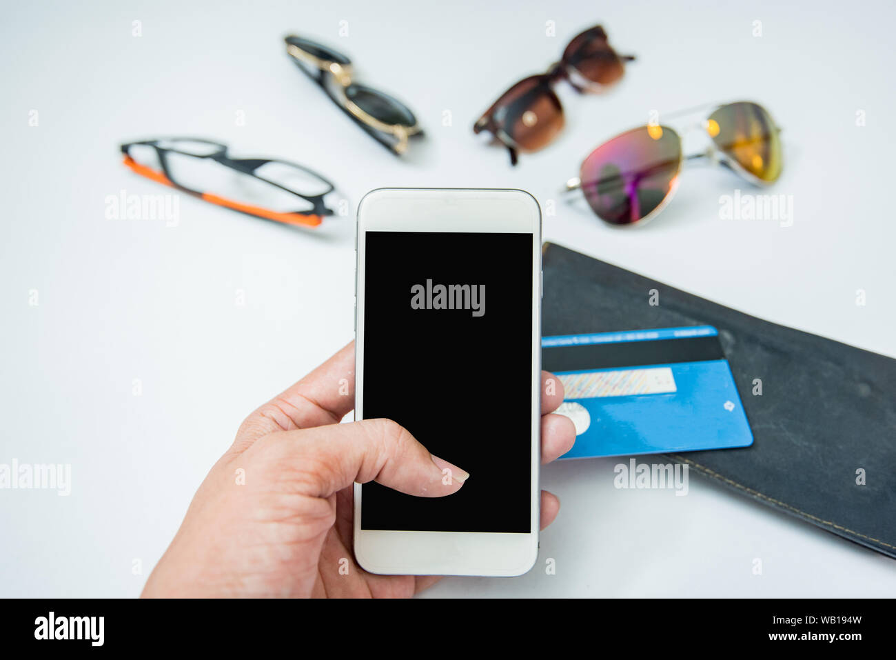 hand using mobile phone credit card, Online Shopping Concept isolated ...