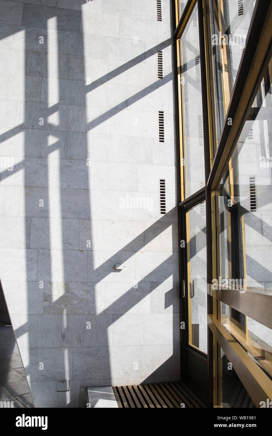 Shadows in a bright interior with marble walls on a bright sunny day ...