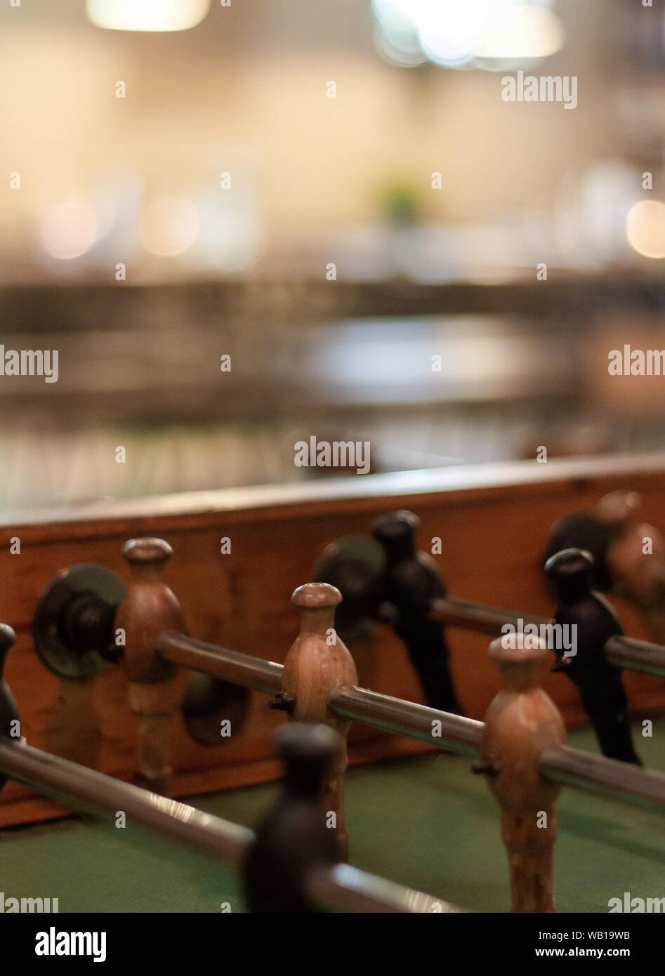 Vertical shot of a wooden foosball with a blurred background Stock ...