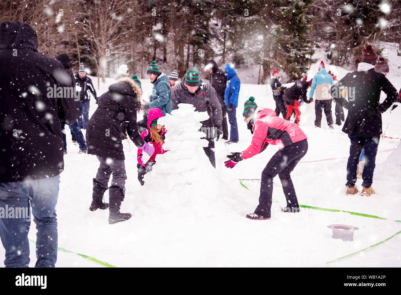 group of young happy business people having a competition in making ...