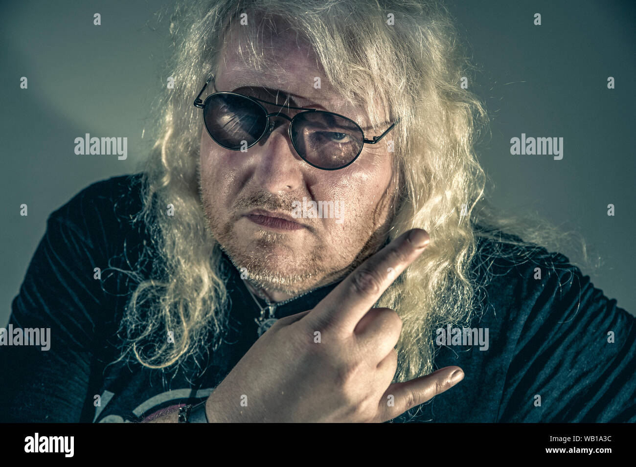 Long hair rocker hi-res stock photography and images - Alamy