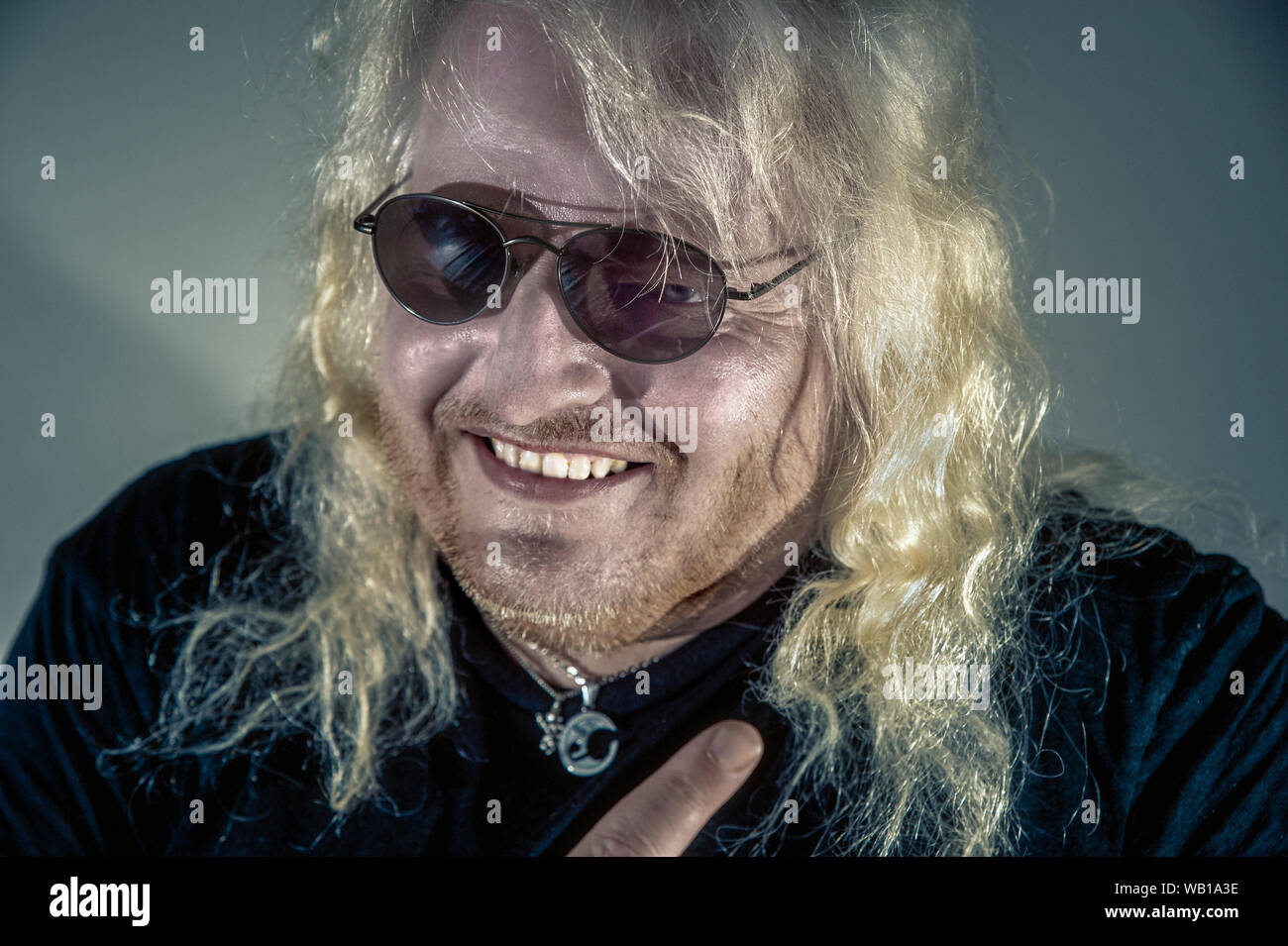Long hair rocker hi-res stock photography and images - Alamy