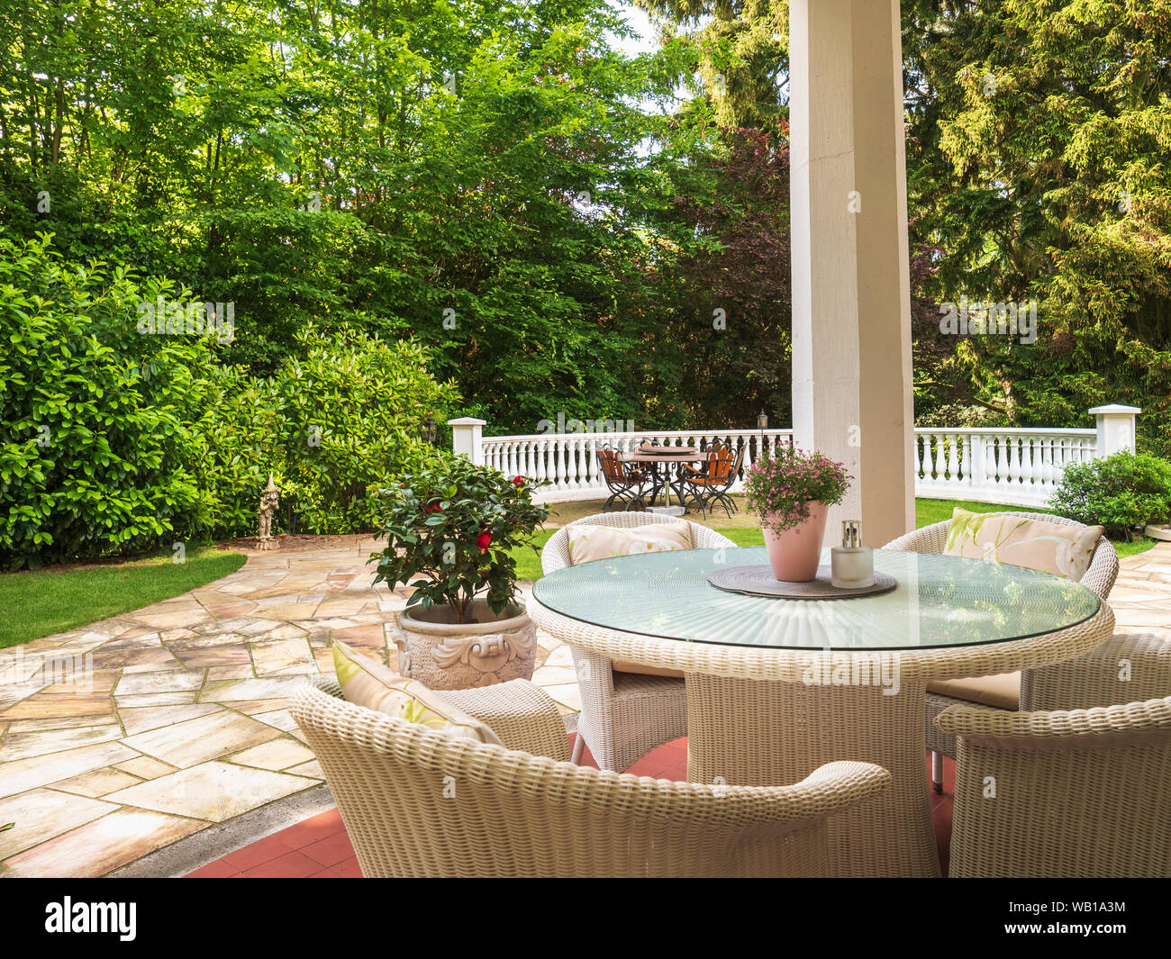 Germany, art nouveau villa, Terrace with white chairs and table Stock ...