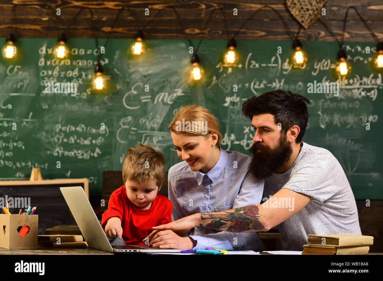 E-Learning concept with student holding his modern laptop computer ...