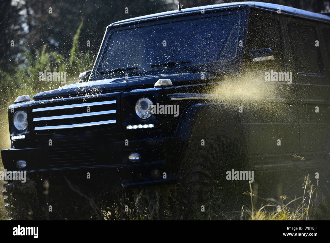 Auto racing on nature background. Off road vehicle or SUV overcomes ...