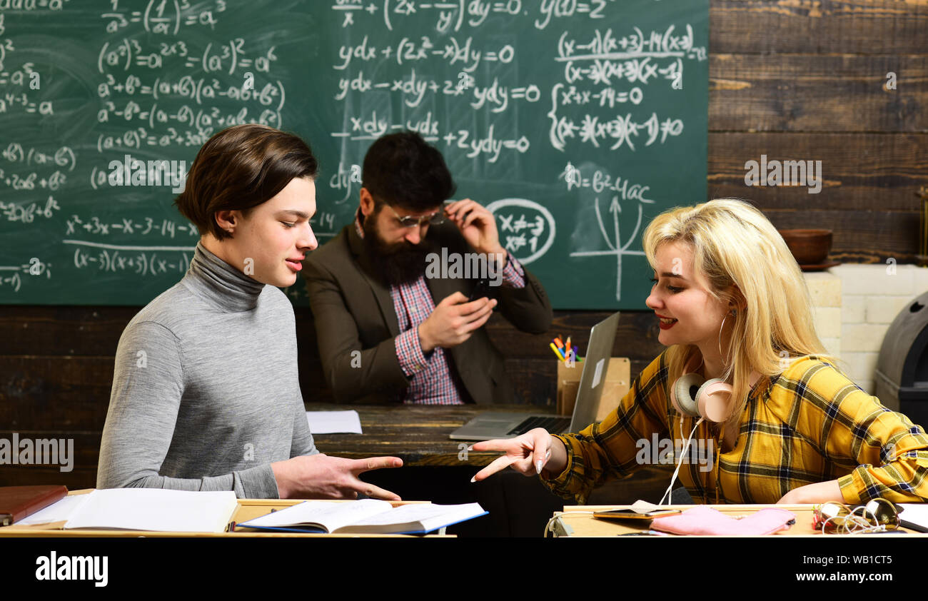 Teacher conveys sense of leadership to students. Teenage female student ...