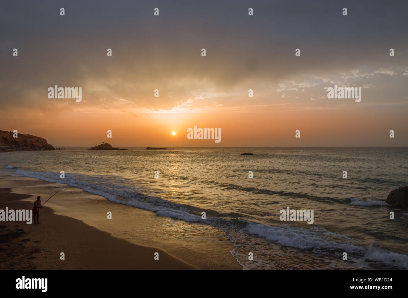 The sunset under the beautiful blue sky on beach Stock Photo - Alamy