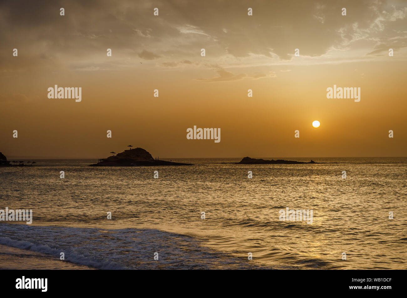The sunset under the beautiful blue sky on beach Stock Photo - Alamy