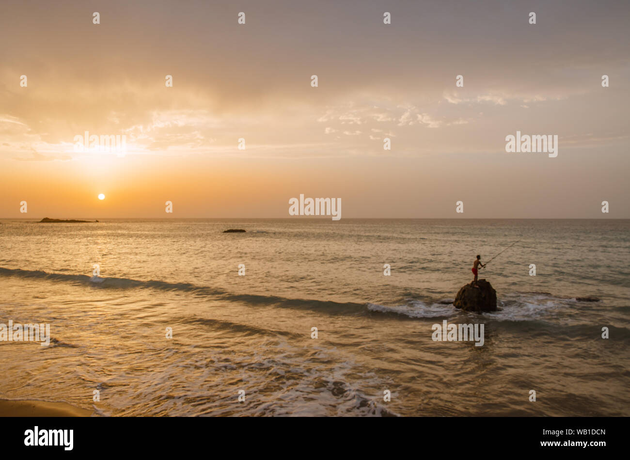 The sunset under the beautiful blue sky on beach Stock Photo - Alamy