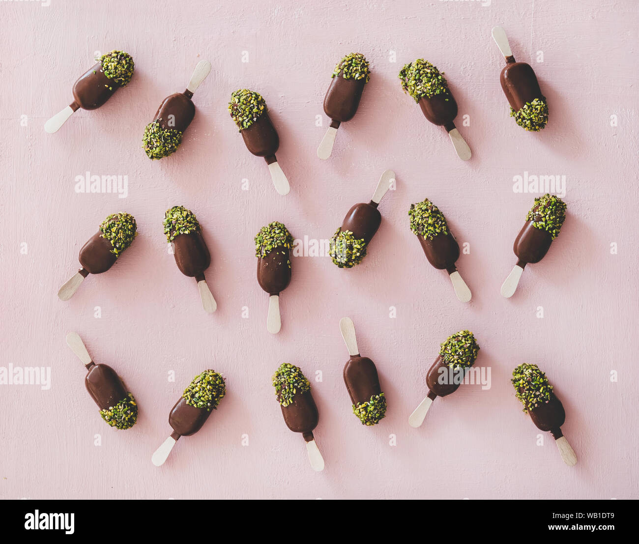 Chocolate glazed ice-cream pops with pistachio icing, top view Stock ...
