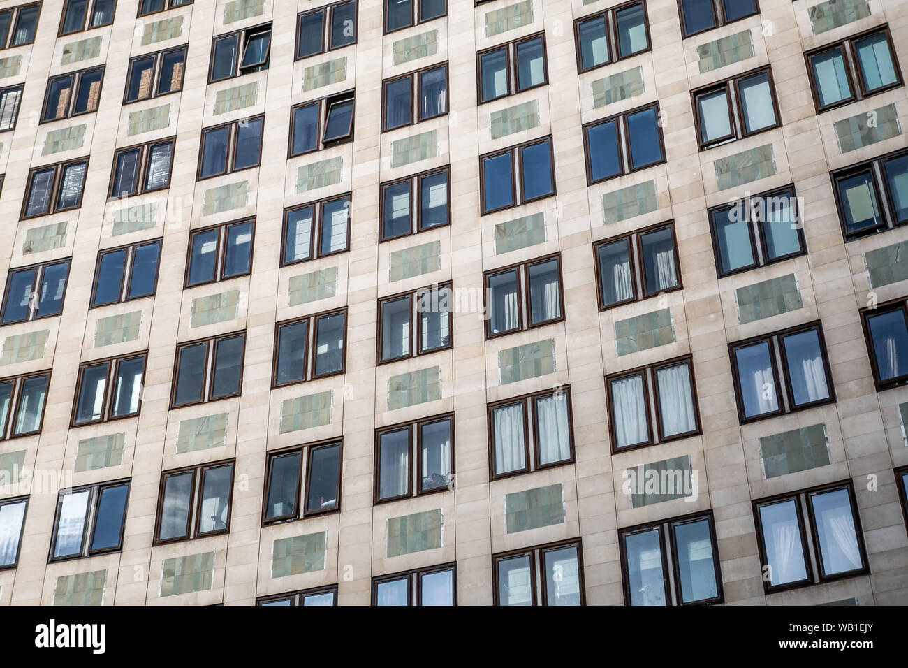Architecture detail closeup of Portland stone apartment building facade ...