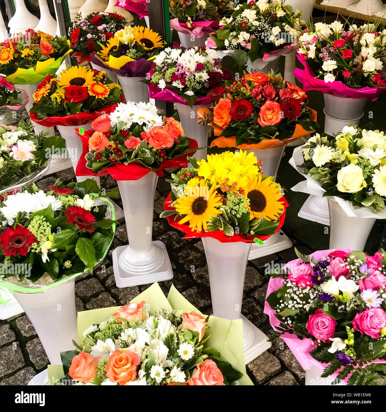 Colorful flower Bouquets at the entrance into street flower shop at ...