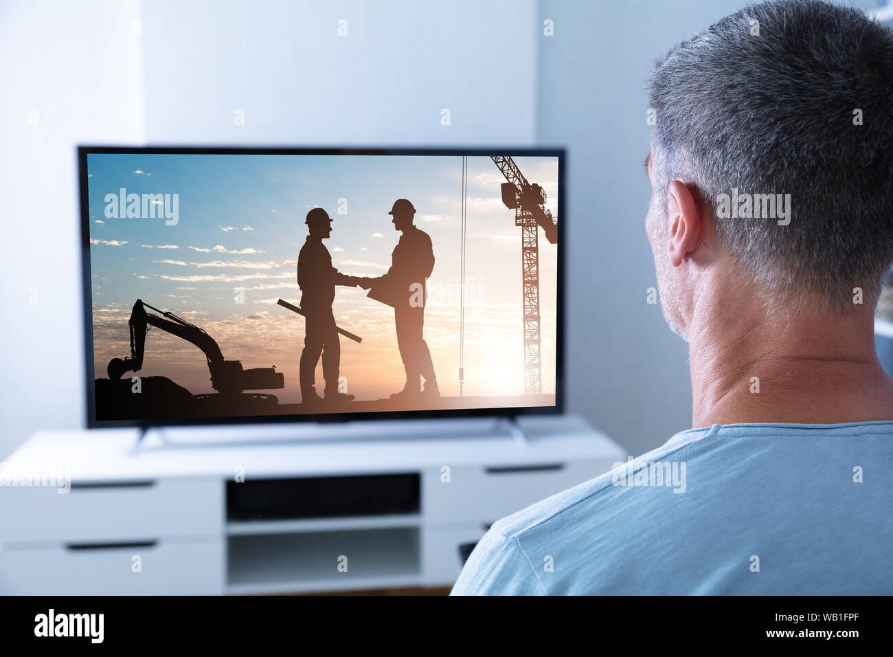 Old man watching tv hi-res stock photography and images - Alamy