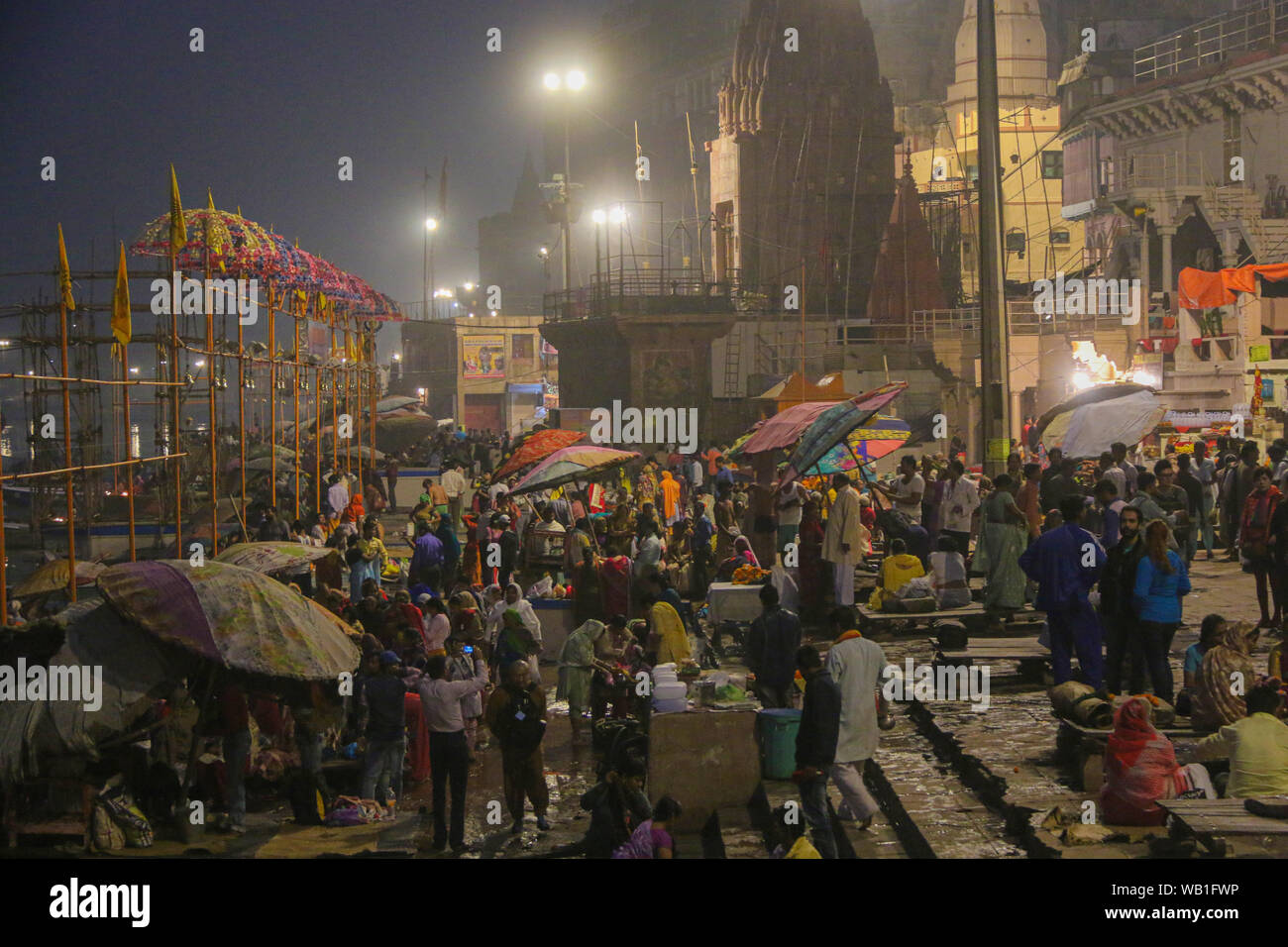 City ghats at night with ancient temples and architectural buildings ...