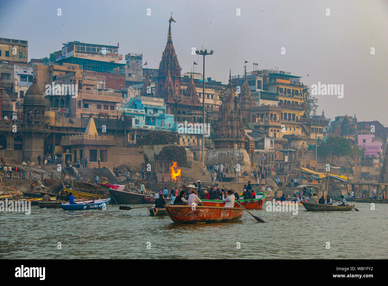 Sacred funeral pyres on the bank of the River Ganges, Varanasi, India ...